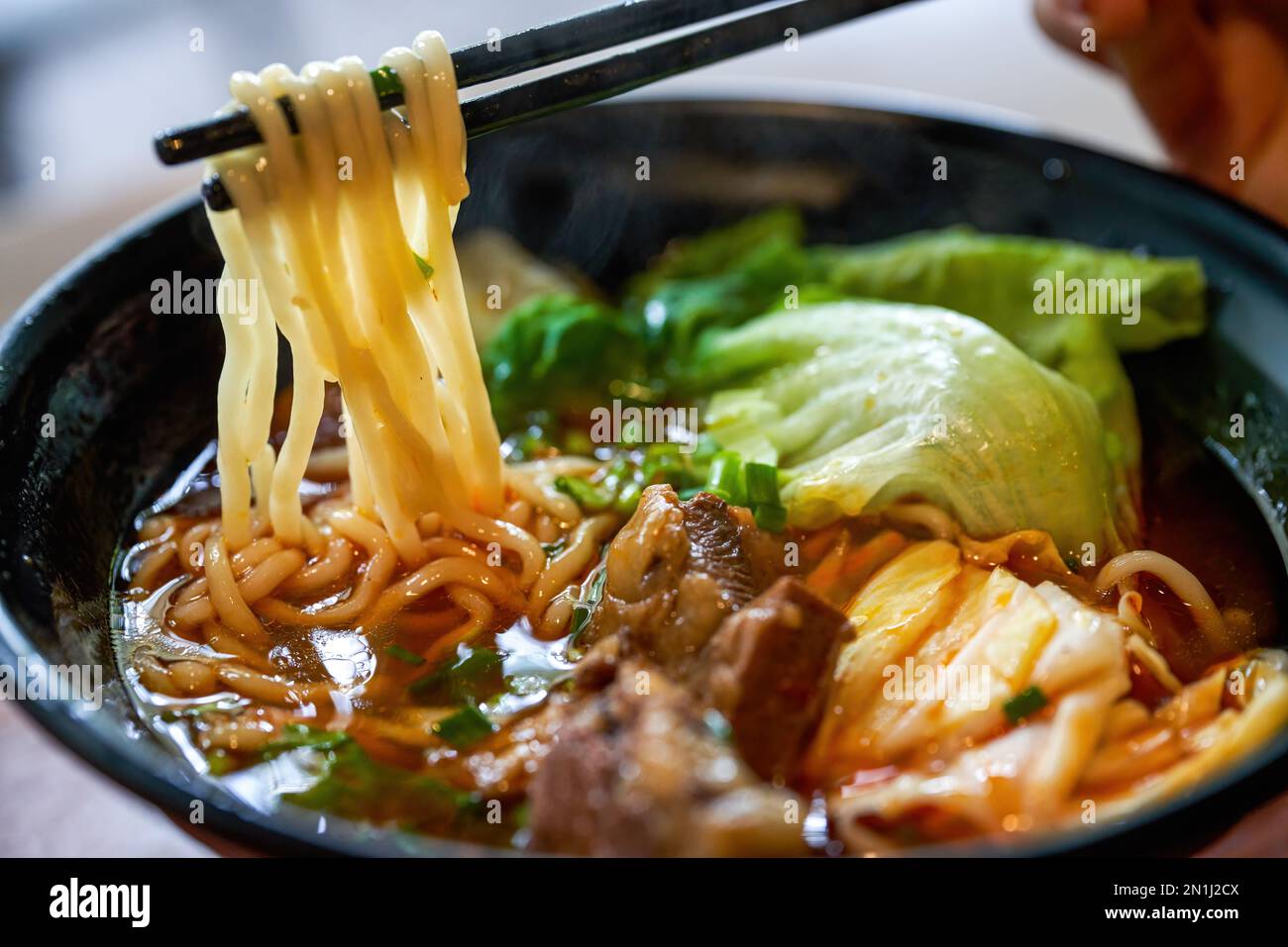 A bowl of delicious and rich Taiwanese braised beef noodles Stock Photo ...