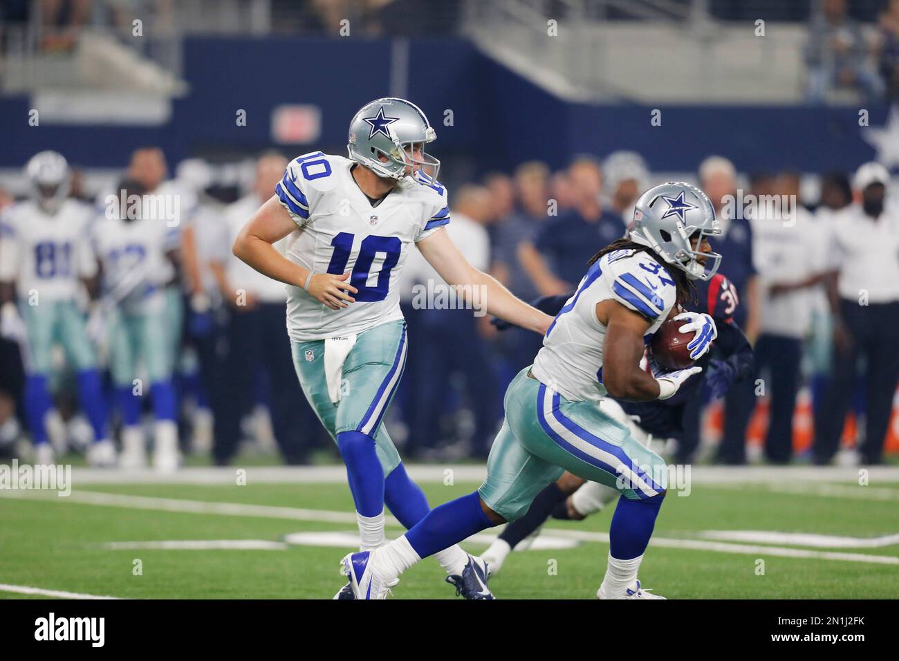 Dallas Cowboys quarterback Dustin Vaughan (10) hands the ball to ...