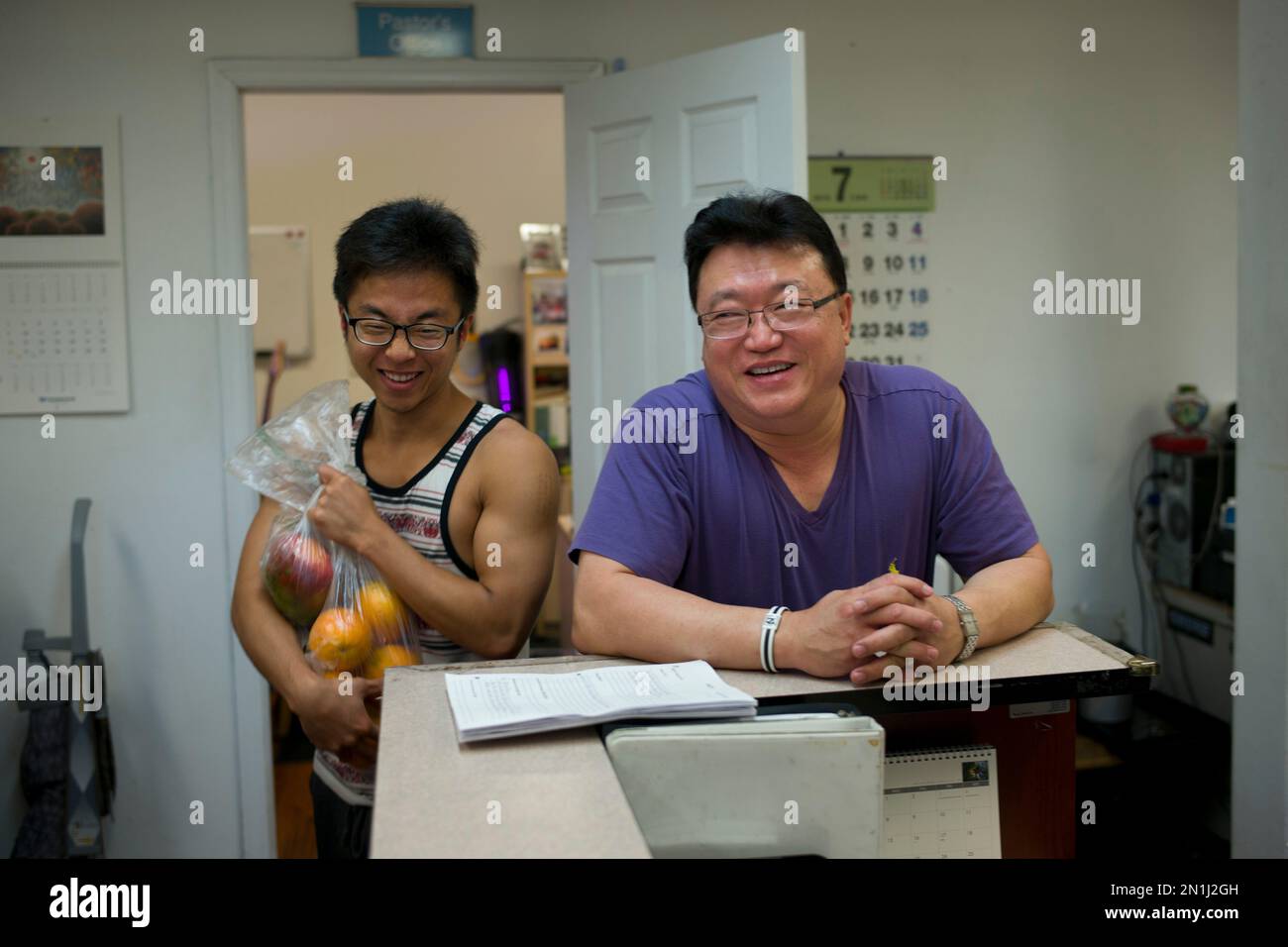 In this Tuesday, July 14, 2015 photo, pastor Young Ho Han, right ...