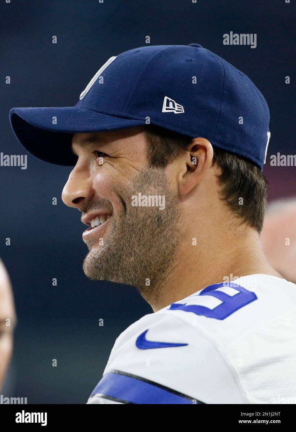 Dallas Cowboys quarterback Tony Romo (9) stands on the sideline ...