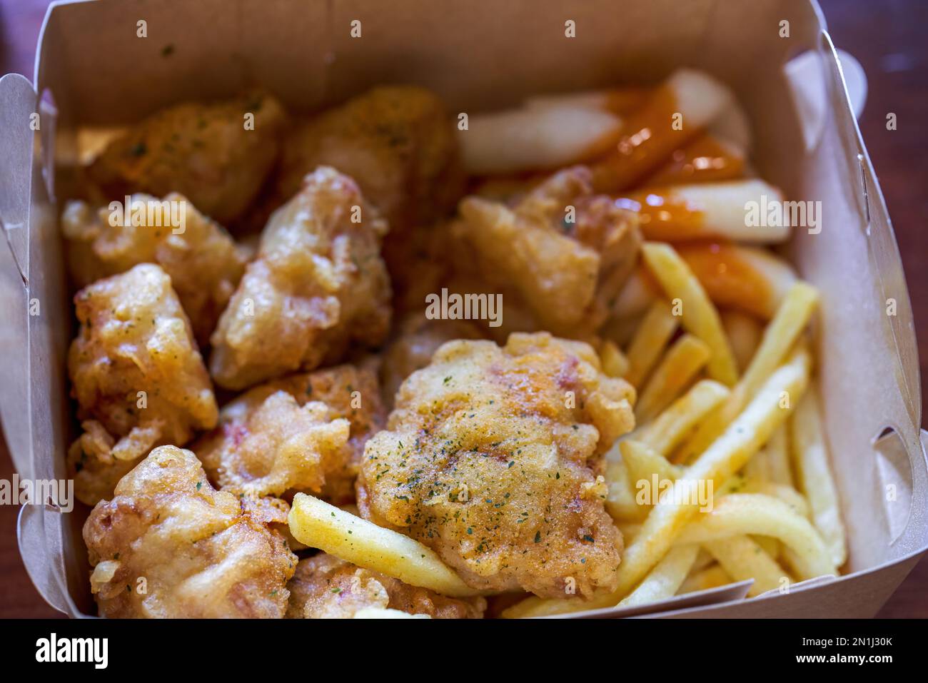 A delicious and crunchy Korean fried chicken served with fried rice ...