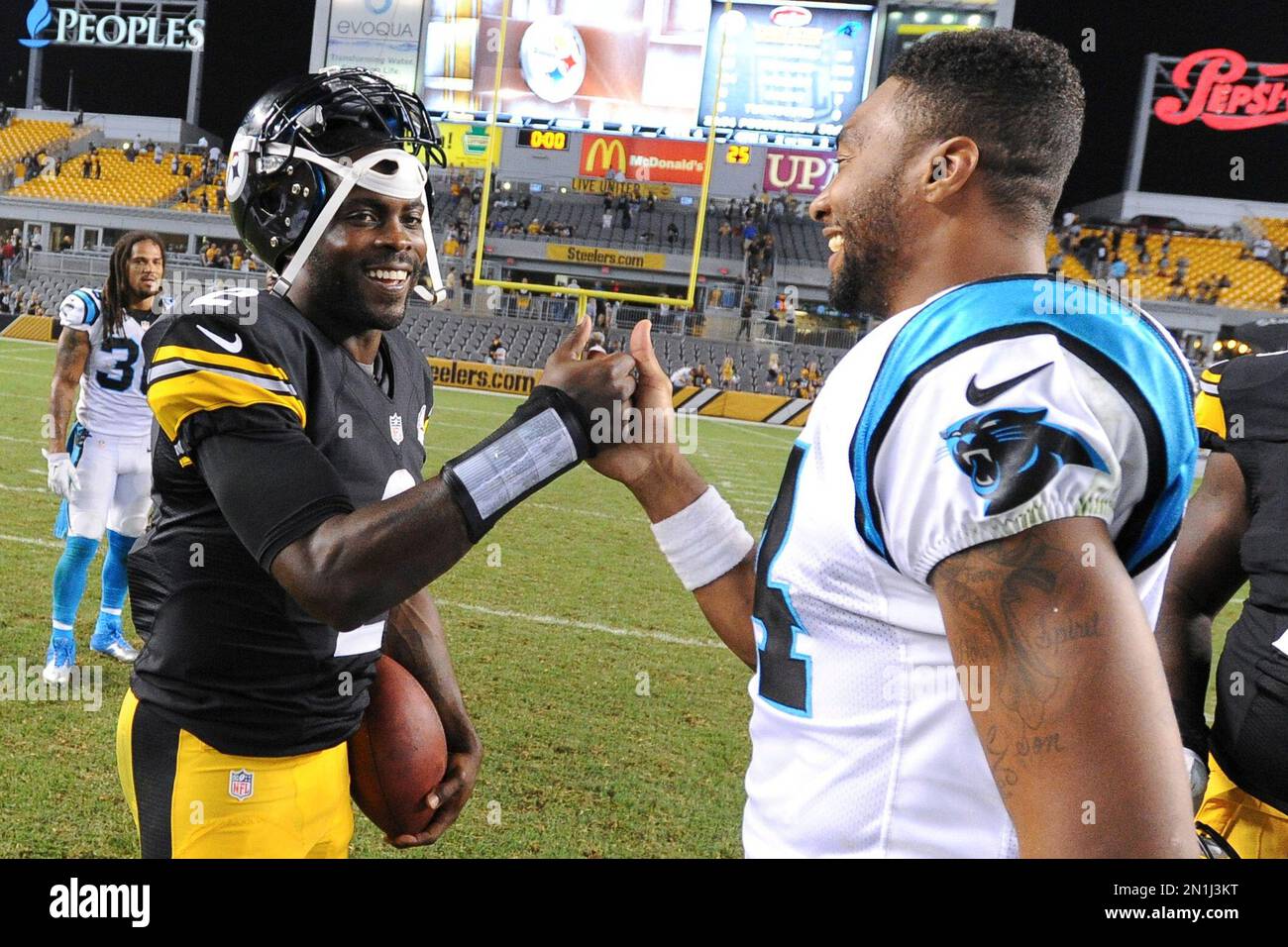 Pittsburgh Steelers quarterback Mike Vick, left, greets Carolina ...