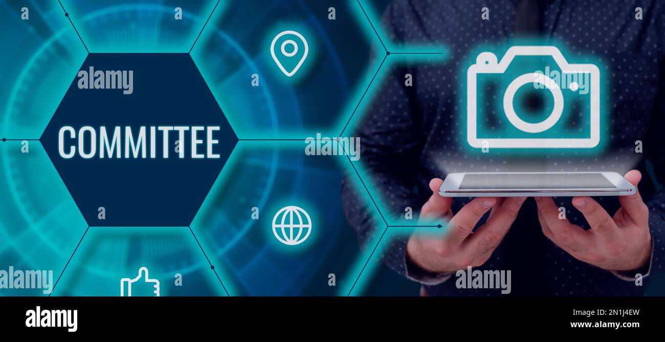 Sign displaying Committee. Word Written on Group of people appointed ...