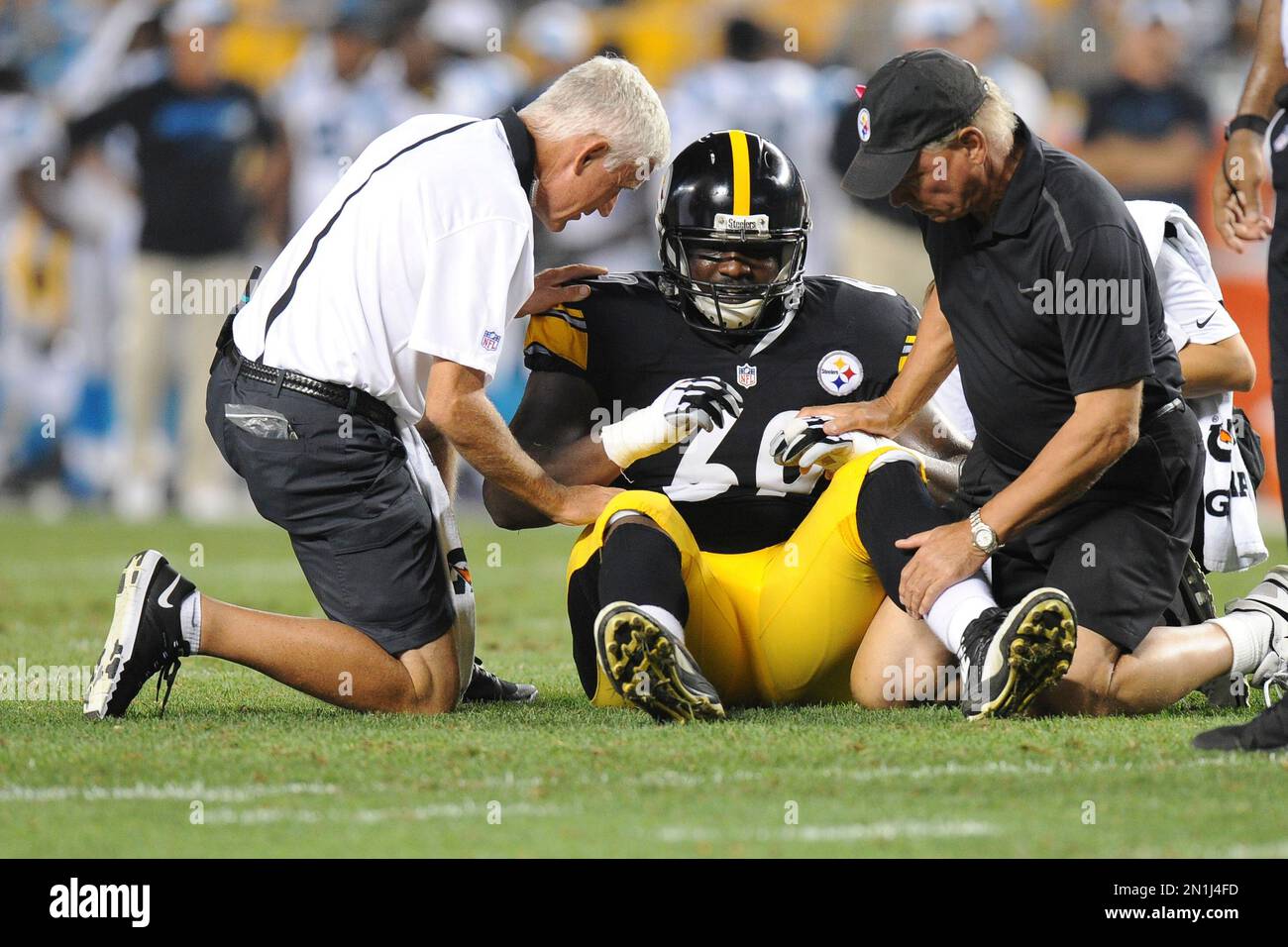 Pittsburgh Steelers tackle Kevin Palmer (69) is tended to after being ...