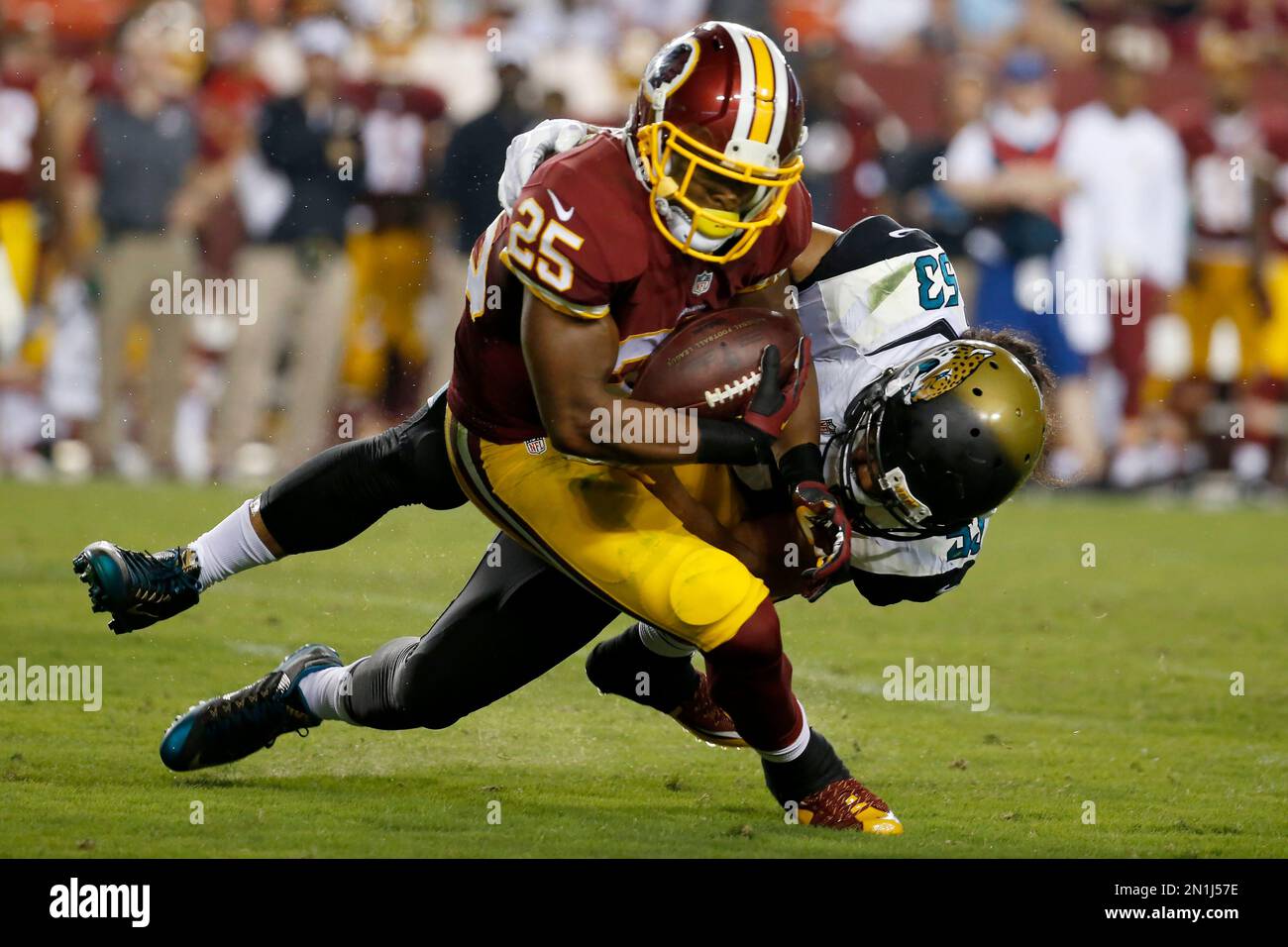 Washington Redskins running back Chris Thompson is stopped by ...