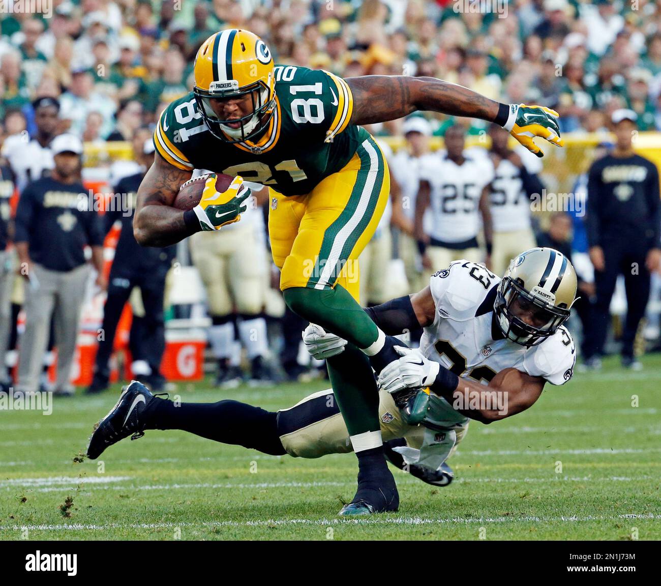 Green Bay Packers' Andrew Quarless tries to get past New Orleans Saints ...