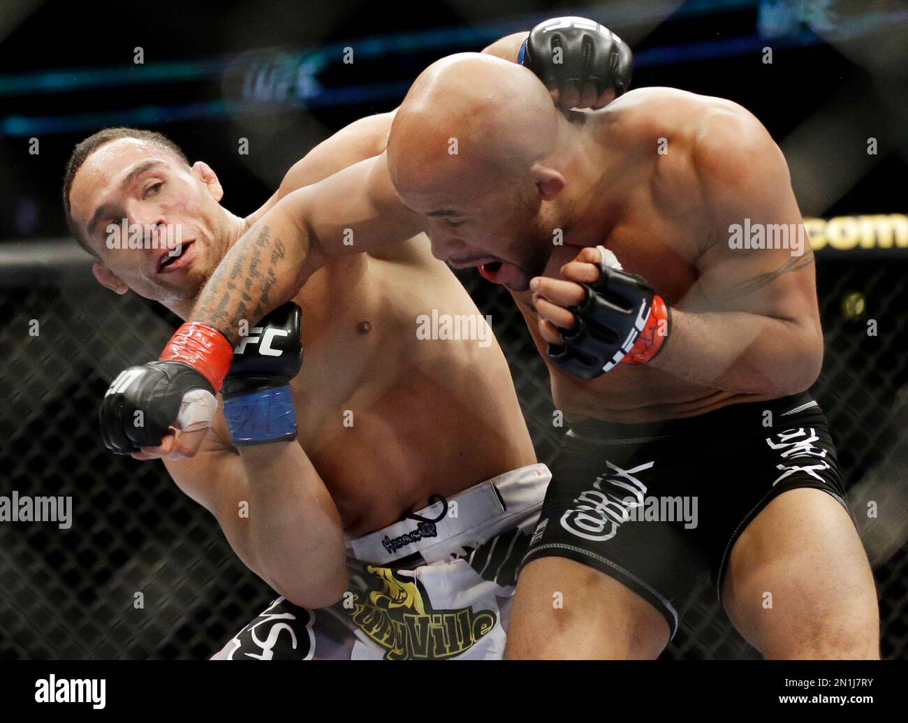 FILE - Jan. 26, 2013 file photo John Dodson, left, fights Demetrious ...
