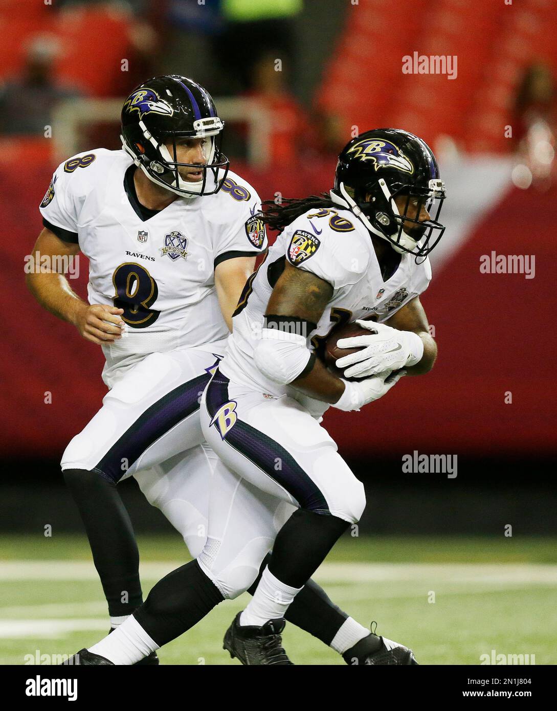 Baltimore Ravens quarterback Matt Schaub (8) hands the ball off to ...