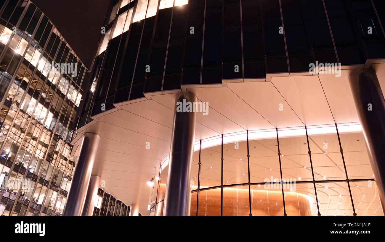 Pattern of office buildings windows illuminated at night. Lighting with ...