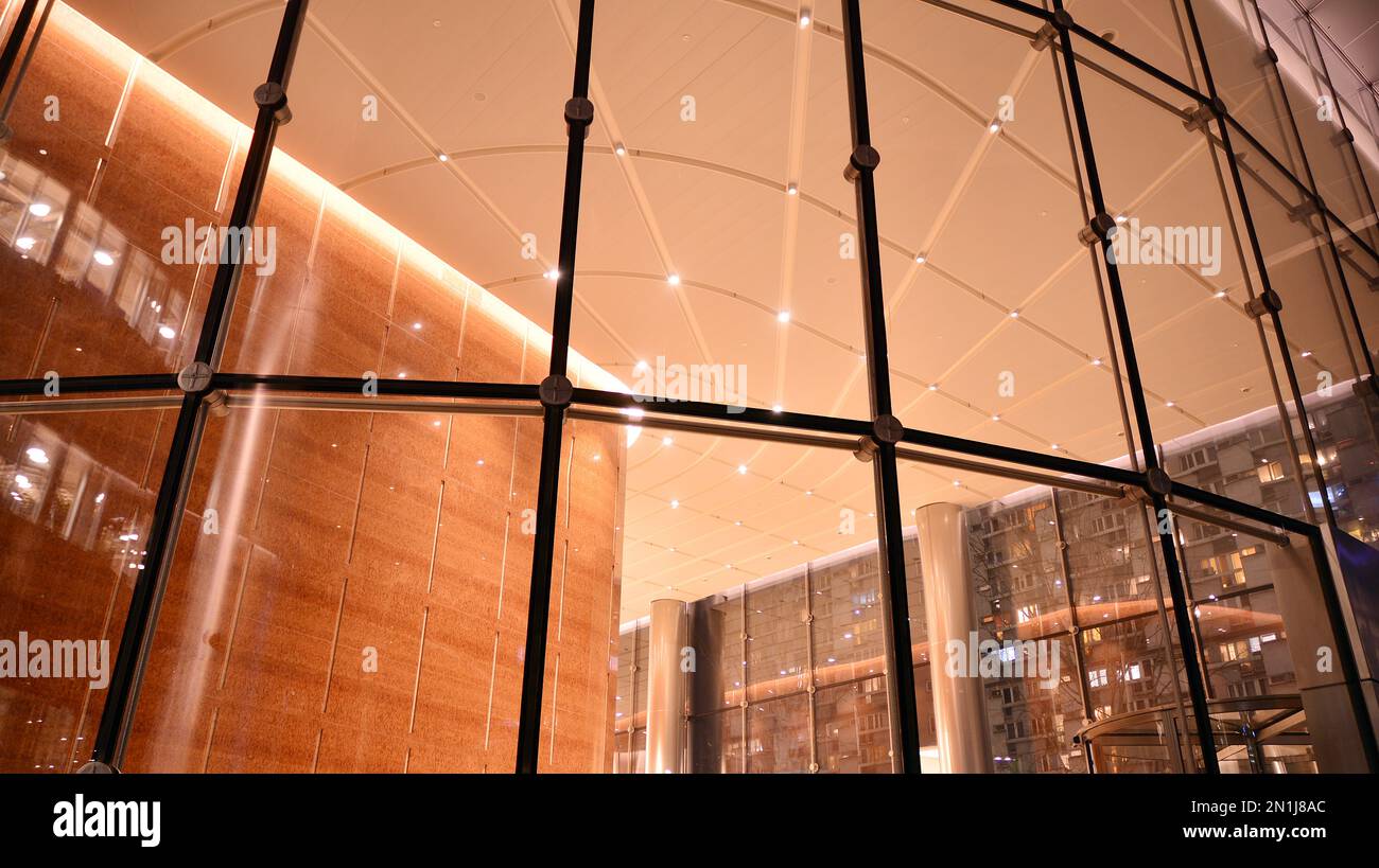 Pattern of office buildings windows illuminated at night. Lighting with ...