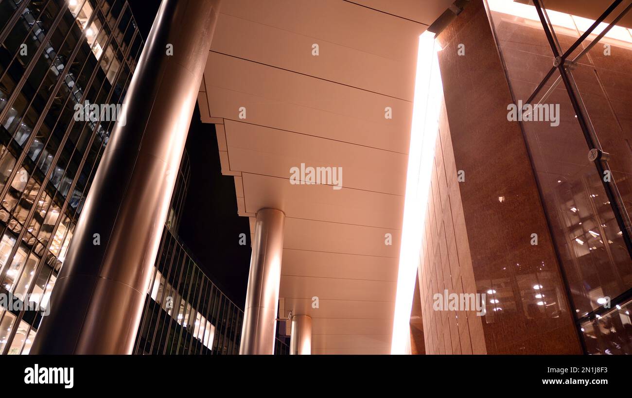 Pattern of office buildings windows illuminated at night. Lighting with ...