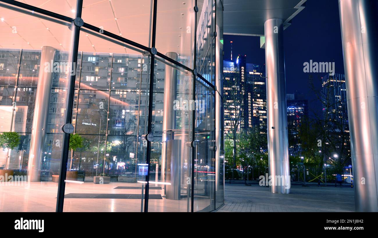 Pattern of office buildings windows illuminated at night. Lighting with ...