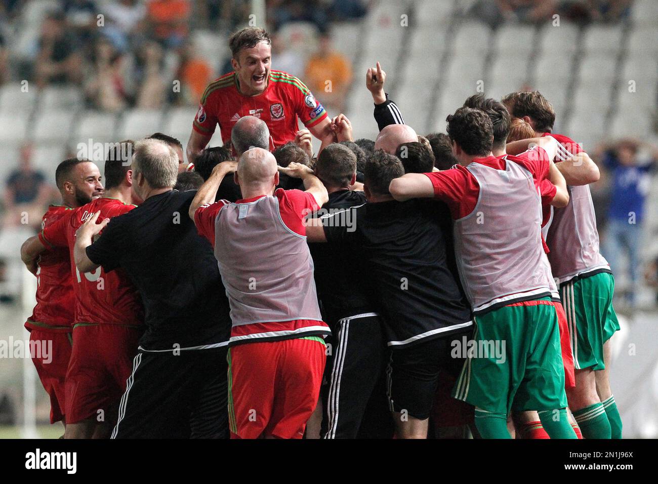 Wales players and team members celebrate a goal by Gareth Bale against ...