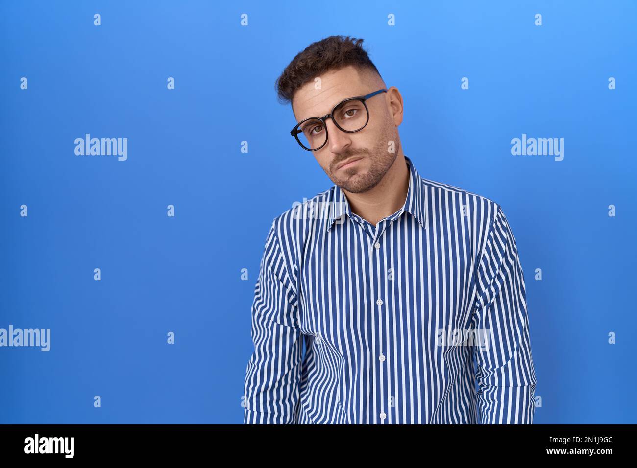Hispanic man with beard wearing glasses looking sleepy and tired ...