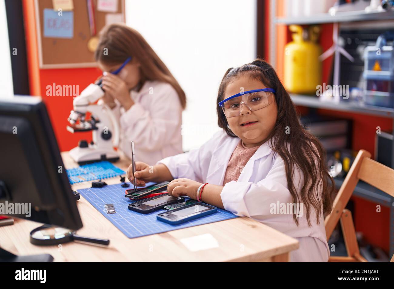 Boy girls using smartphone together hi-res stock photography and images ...