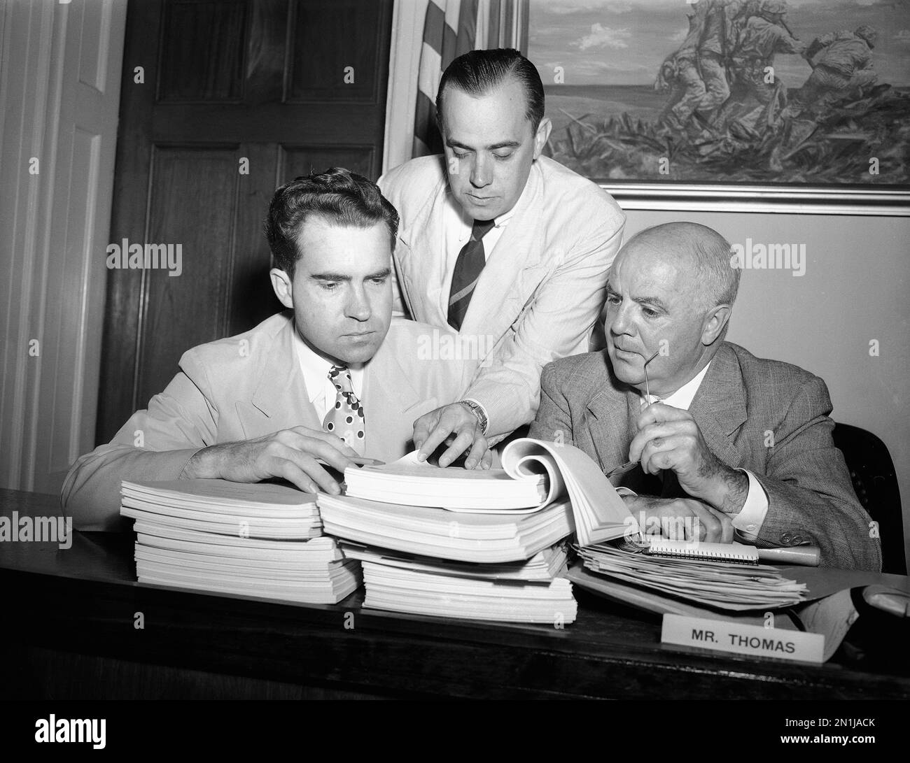 Rep. Richard Nixon, R-Calif., left, investigator Robert Stripling, center and Rep. J. Parnell ...