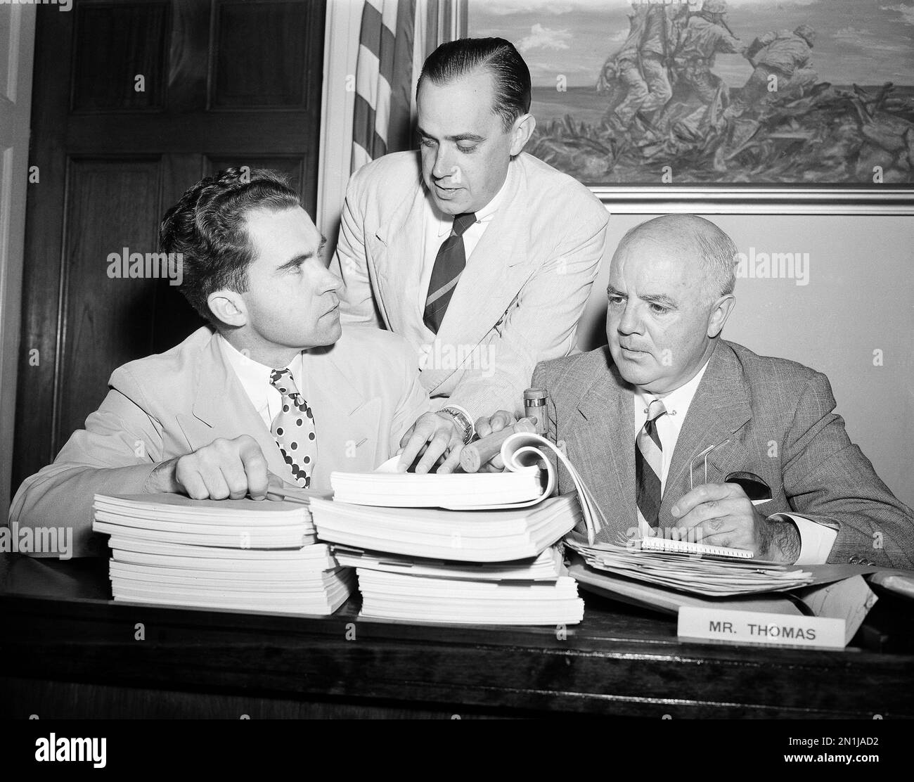 Rep. Richard Nixon, R-Calif., left, investigator Robert Stripling, center and Rep. J. Parnell ...
