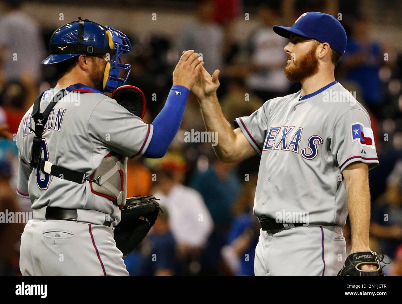 Texas Rangers relief pitcher Sam Dyson and catcher Bobby Wilson high ...
