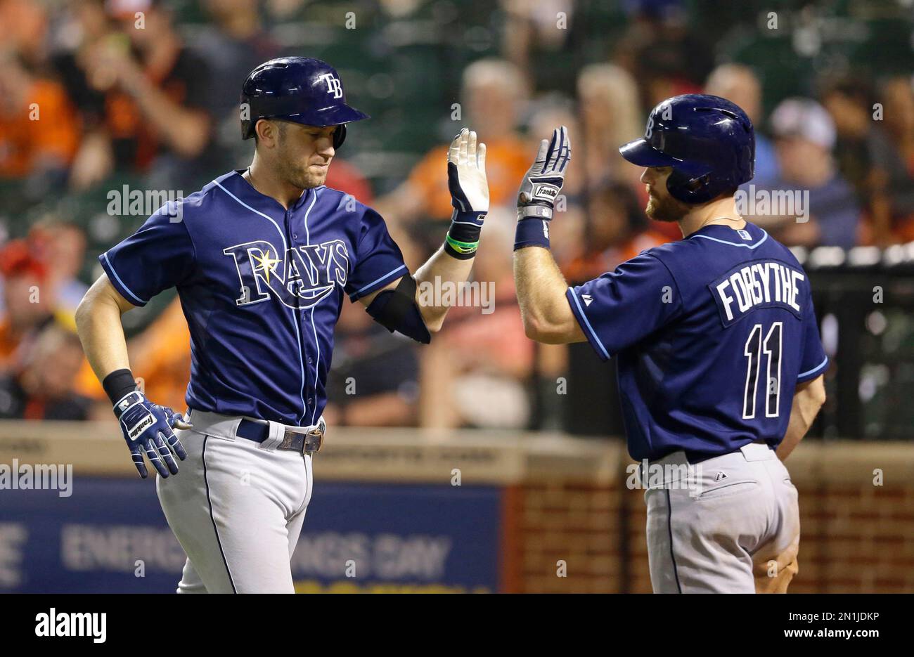 Tampa Bay Rays' Evan Longoria, left, high-fives teammate Logan Forsythe ...