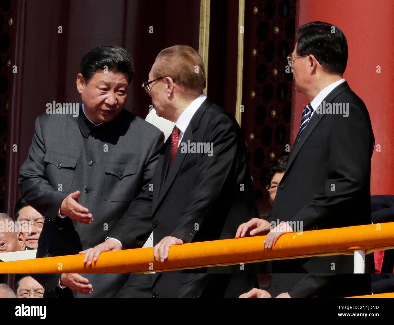 Chinese President Xi Jinping, left, talks with former Chinese President ...