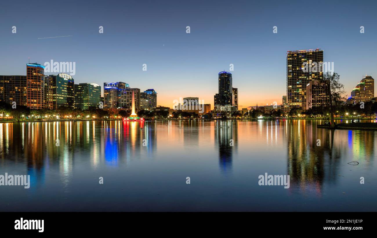 Orlando city skyline at night. Panoramic view of Orlando in Lake Eola ...
