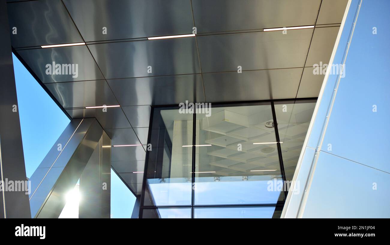 Combination of metal and glass wall material. Steel facade on columns ...