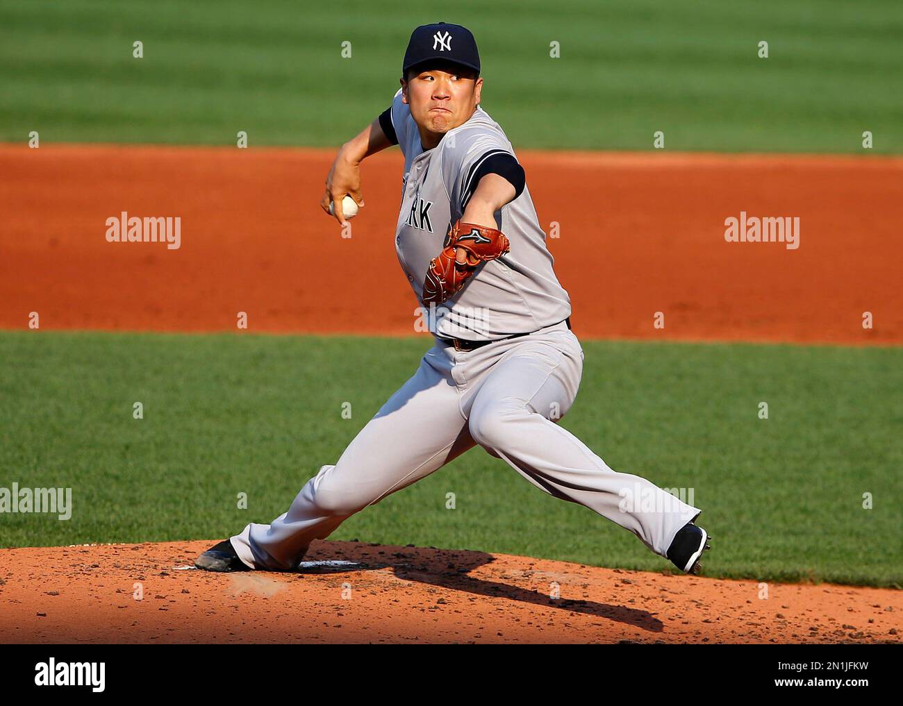 New York Yankees starting pitcher Masahiro Tanaka, of Japan, delivers ...