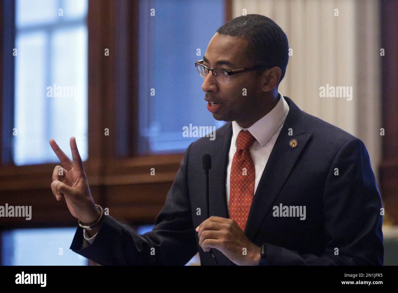 Illinois Rep. Christian Mitchell, D-Chicago, speaks to lawmakers while ...