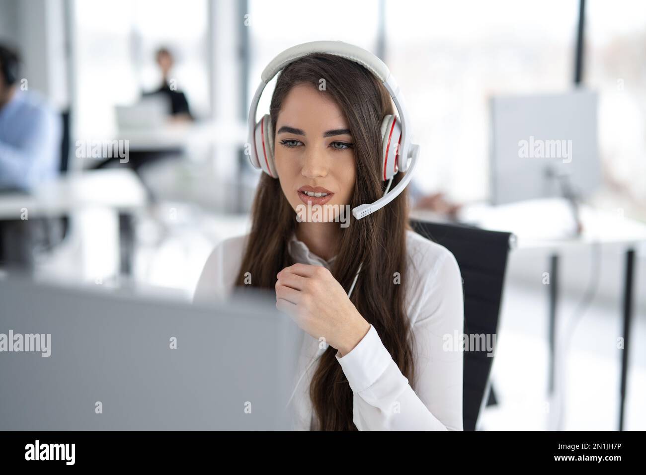 Portrait of dedicated female operator agent working at IT support sector Stock Photo - Alamy