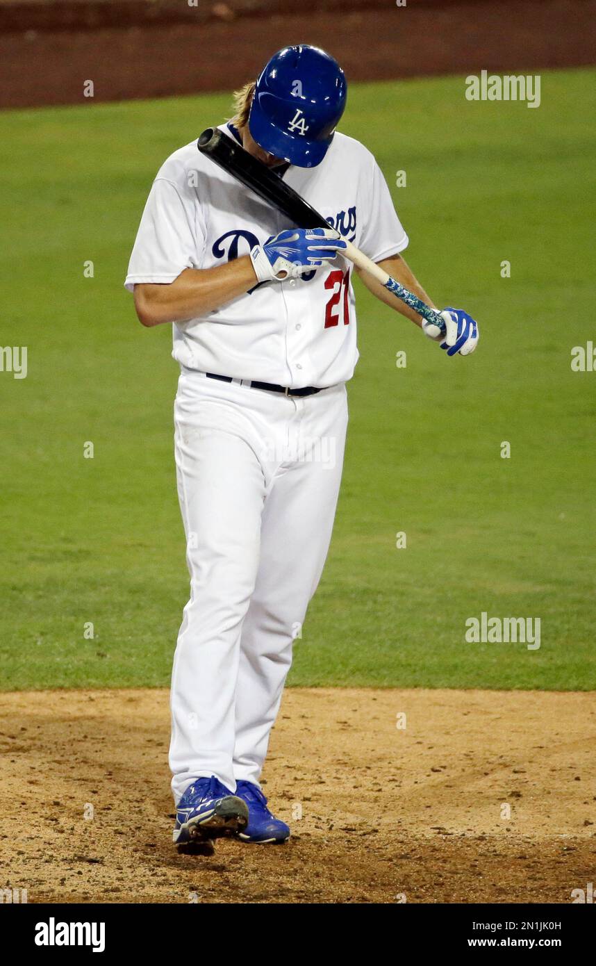 Los Angeles Dodgers' Zack Greinke kisses his bat during a baseball game against the San ...