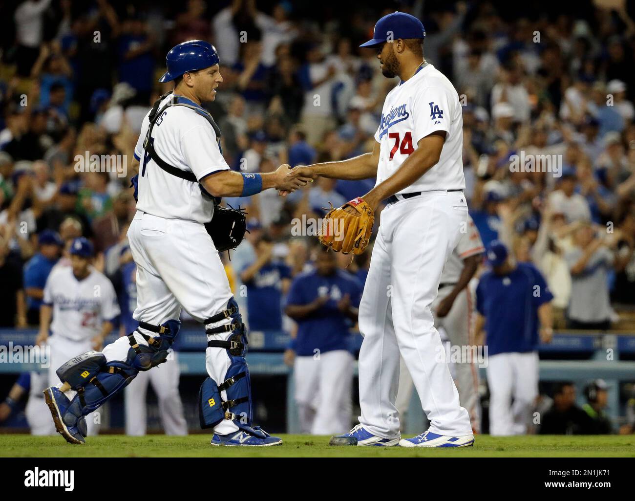 Los Angeles Dodgers catcher A.J. Ellis, left, and relief pitcher Kenley ...