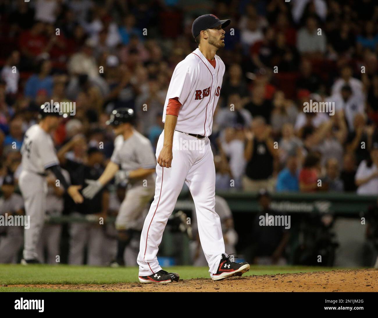 Boston Red Sox's Rick Porcello, right, walks across the mound as New ...