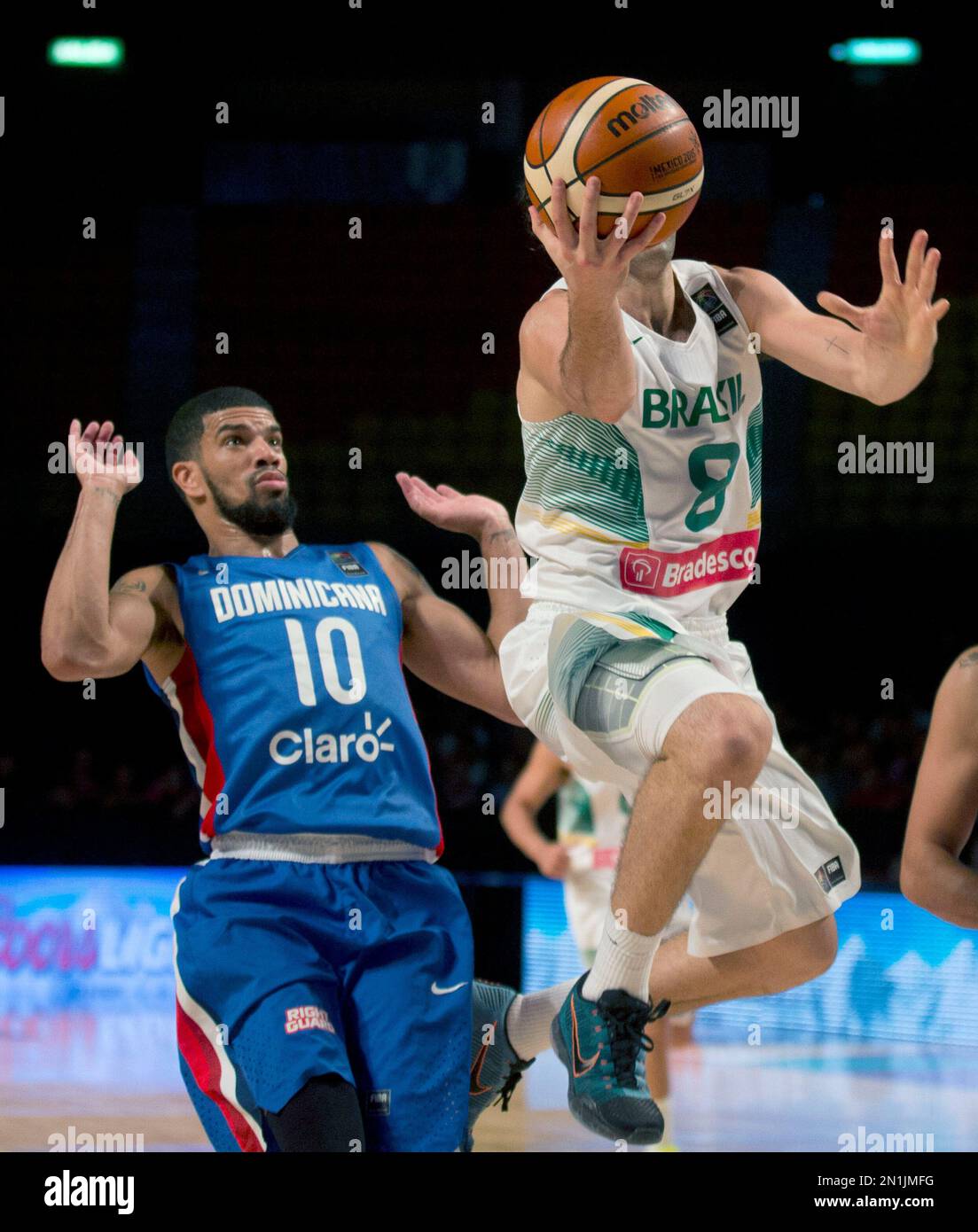 Brazil's Leo Meindl, right, goes for a shot over Dominican Republic's ...