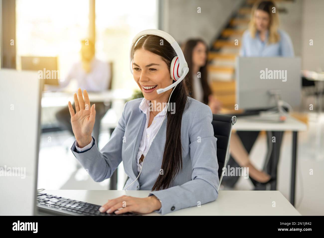 Businesswoman waving hand speaking on hi-res stock photography and ...