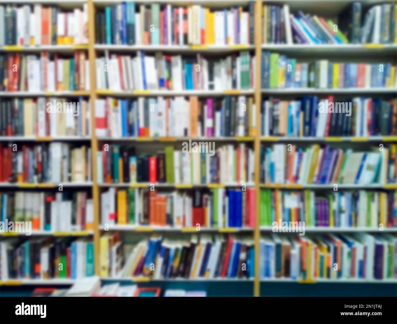 Blurred of bookshelves in the public library. Blurred effect Background ...