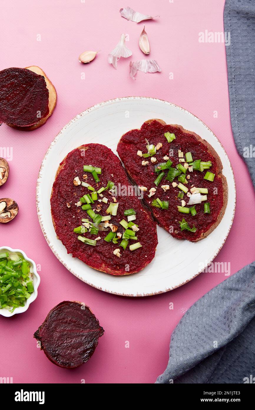 Vegetarian sandwiches with healthy beetroot spread and young onion ...