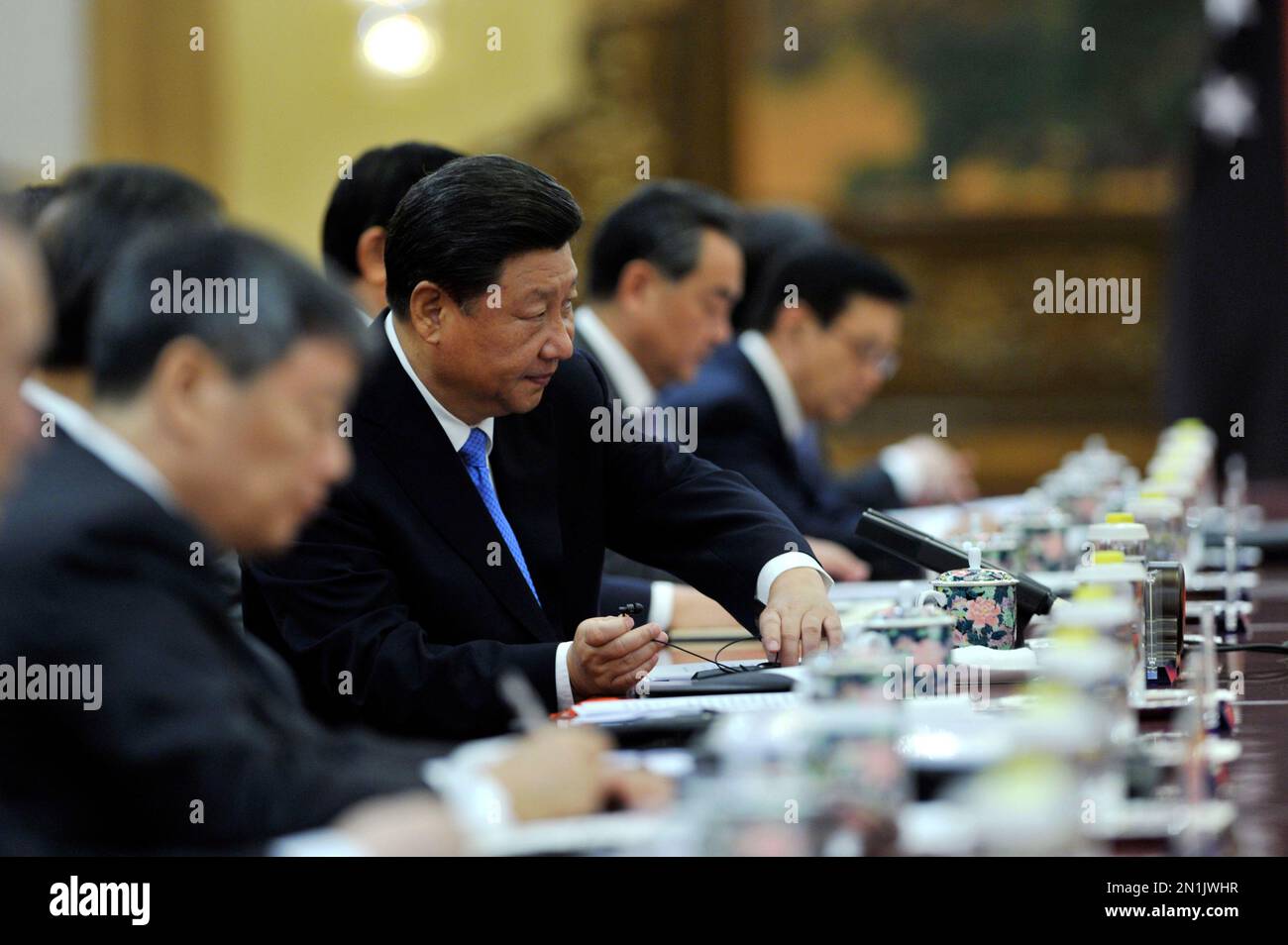 Chinese President Xi Jinping, third left, attends a meeting with Papua ...
