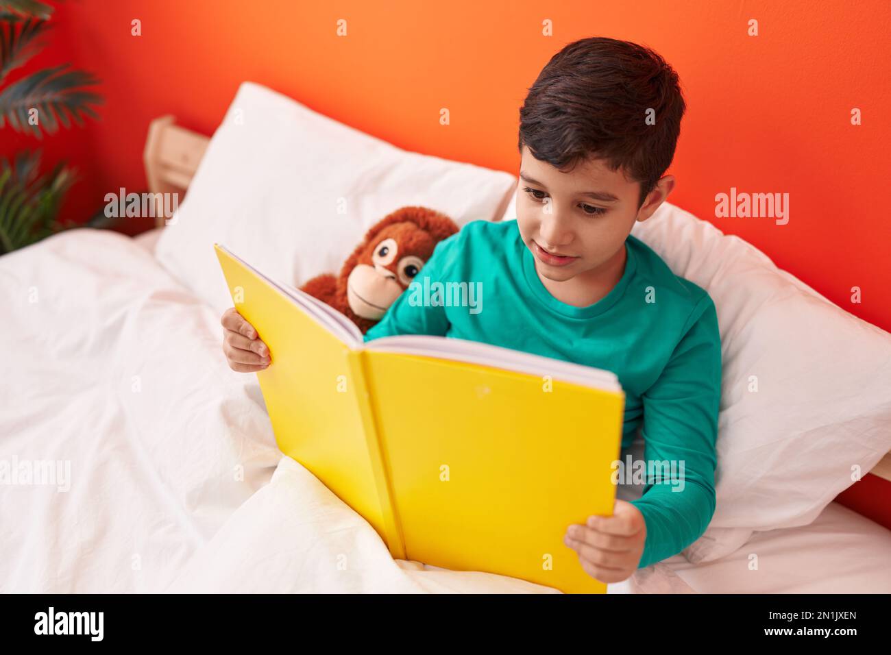 Hispanic boy reading book hi-res stock photography and images - Alamy