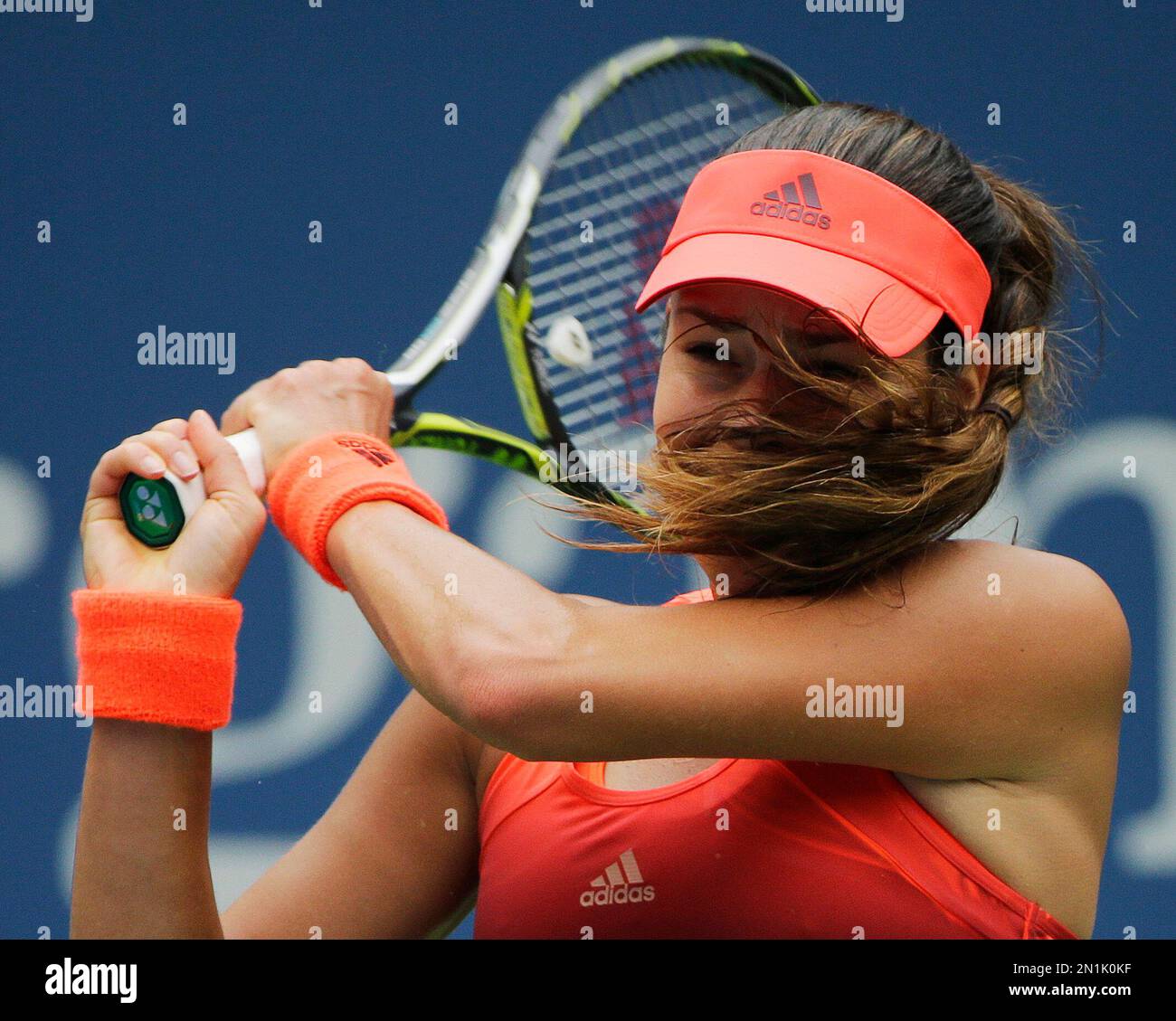 Ana Ivanovic, of Serbia, follows through on a shot against Dominika ...