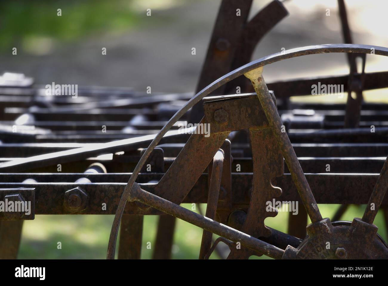 Vintage rusty wrought iron farm equipment Stock Photo - Alamy