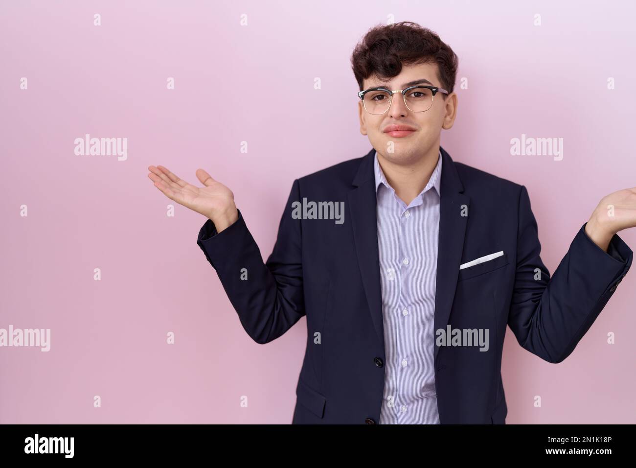 Young non binary man with beard wearing suit and tie clueless and ...