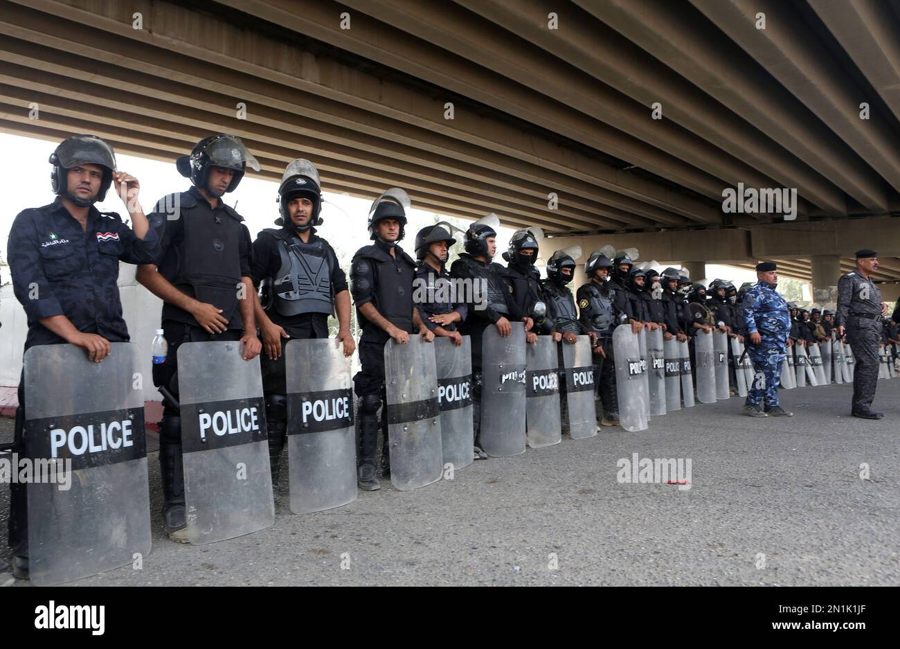 Iraqi riot police guard the heavily fortified Green Zone during a ...