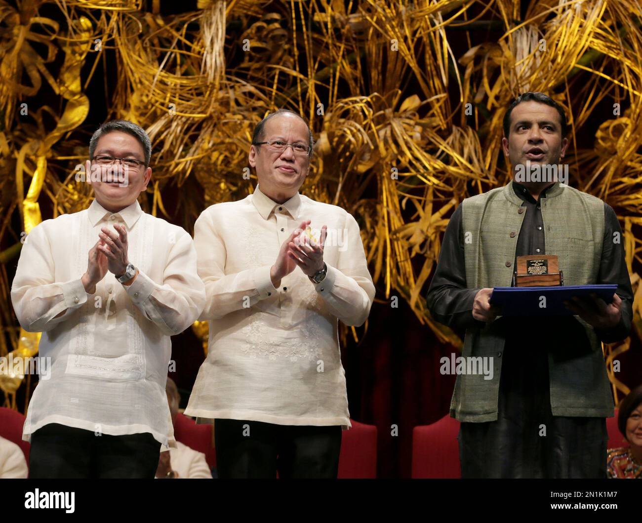 Philippine President Benigno Aquino III, center, and Fr. Jose Ramon ...