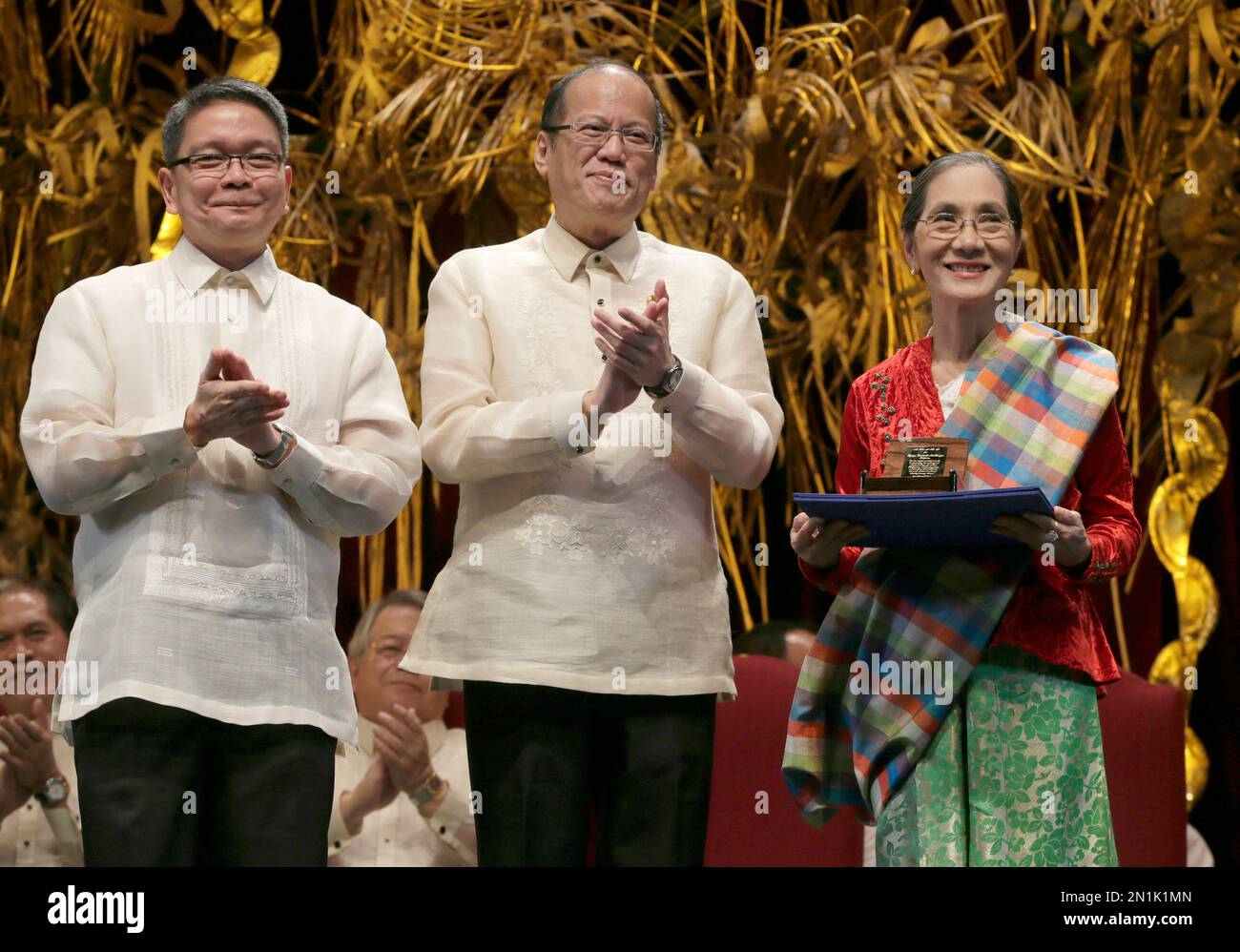 The Philippines' Ligaya Fernando-Amilbangsa, right, is applauded by ...