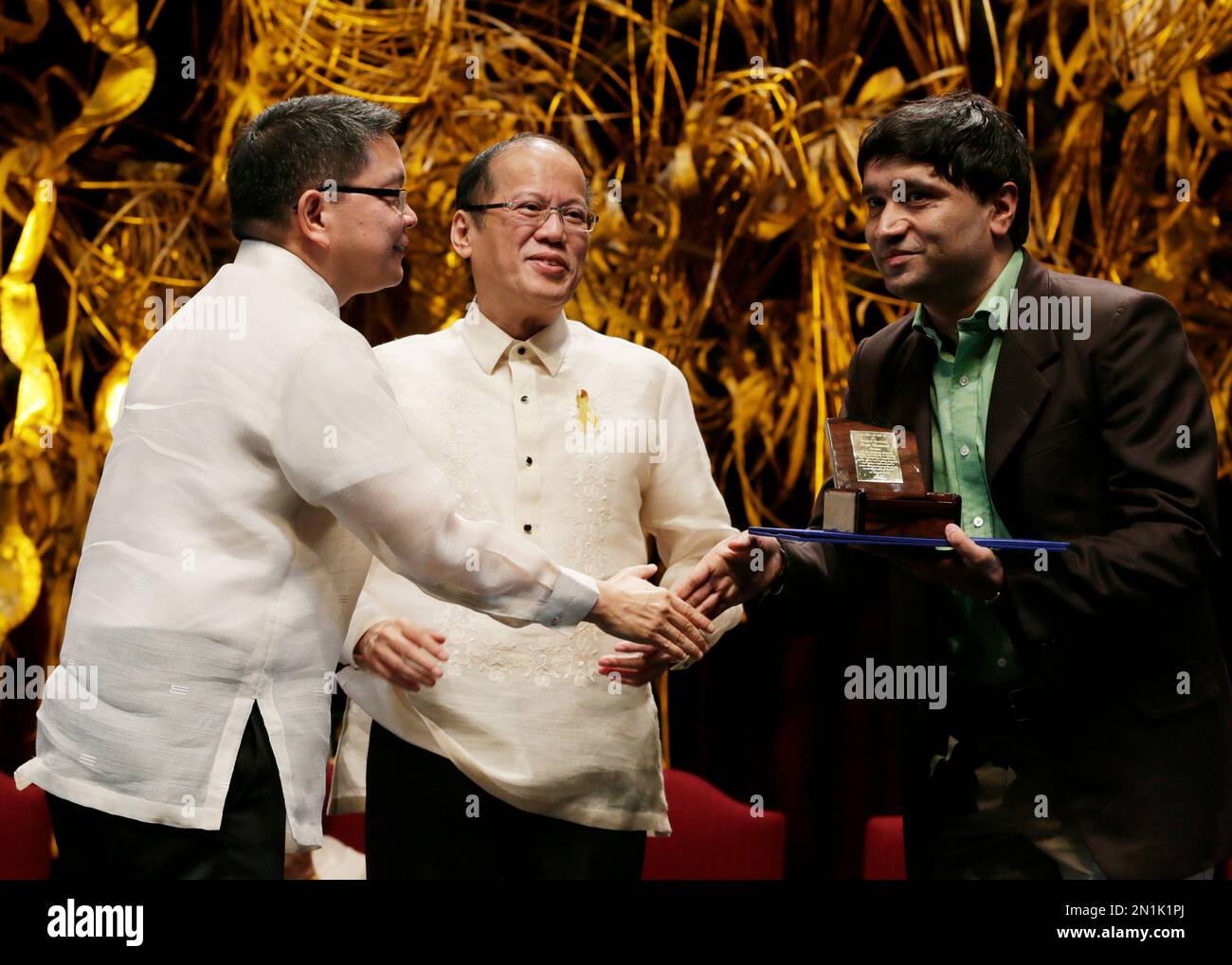 Fr. Jose Ramon Villarin, left, chair of the Ramon Magsaysay Awards ...