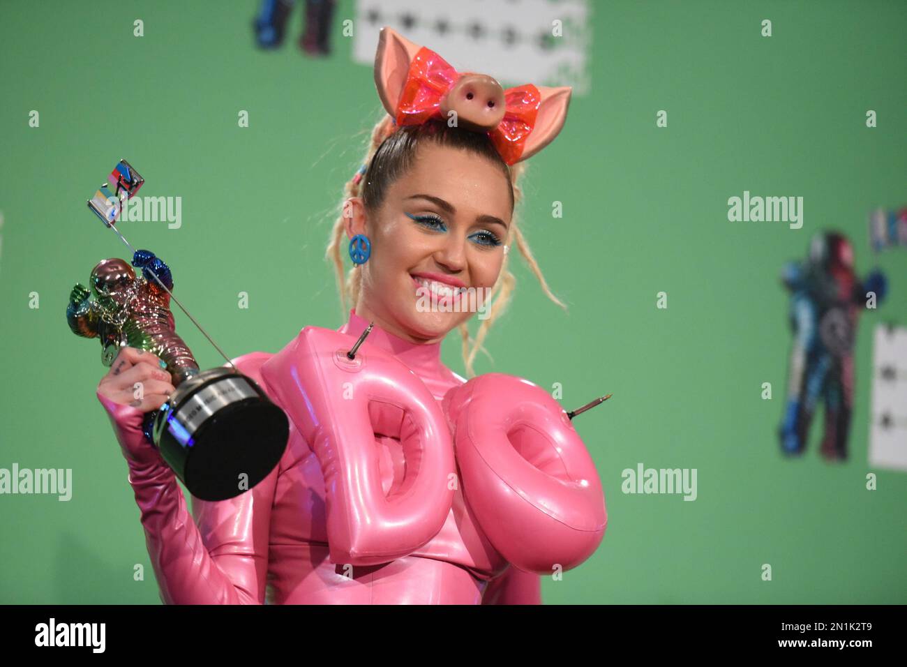 Miley Cyrus poses in the press room at the MTV Video Music Awards at ...