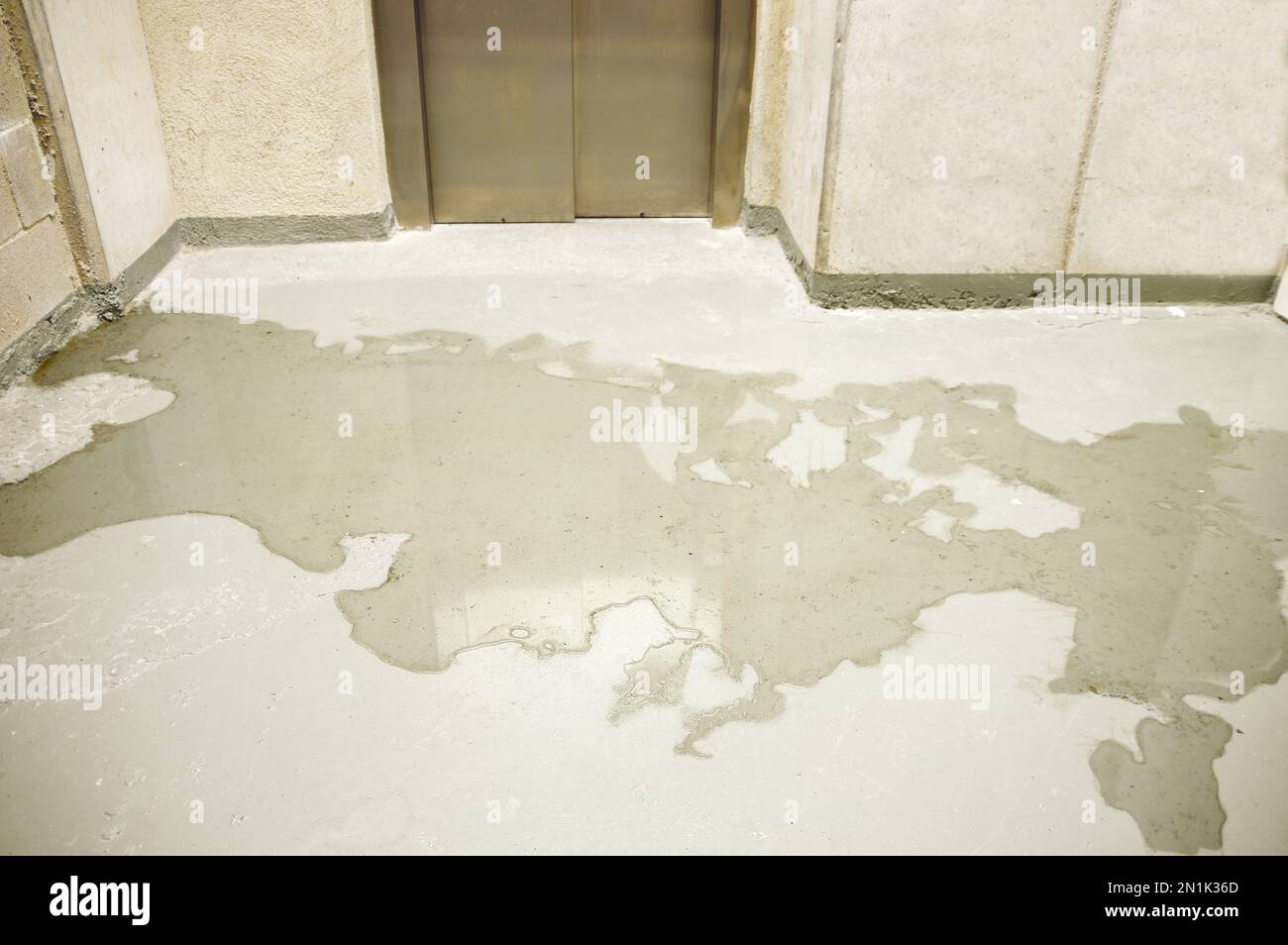 Rain water leaks on the floor causing damage next to the door of an ...