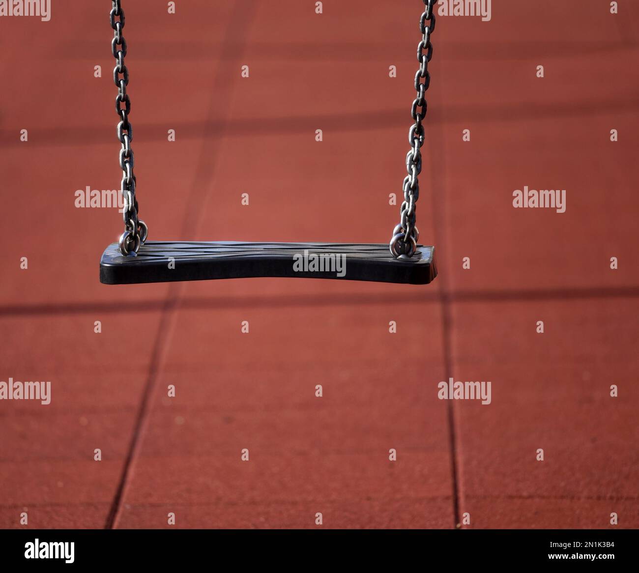 Outdoor kids playground hanging swing seat with chains Stock Photo - Alamy