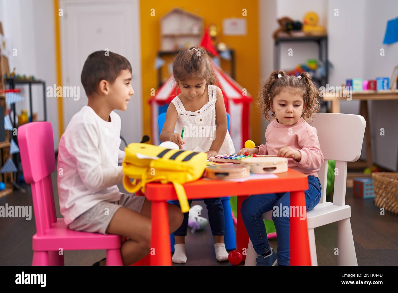 Group of kids preschool students sitting on table drawing on paper at ...
