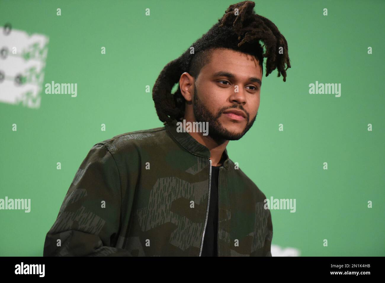 The Weeknd poses in the press room at the MTV Video Music Awards at the ...